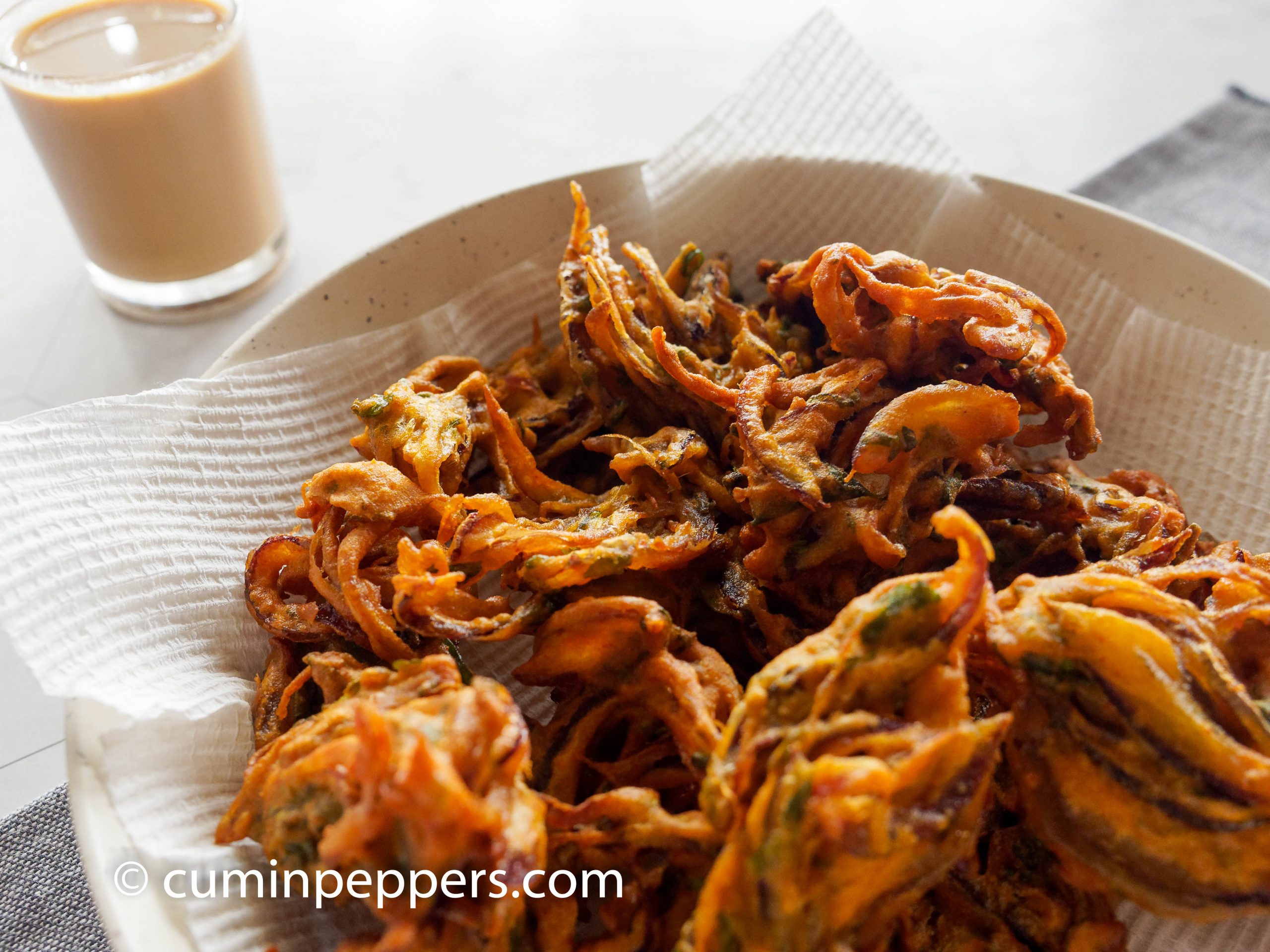 yummy snack recipe | onion pakoda recipe - CuminPeppers